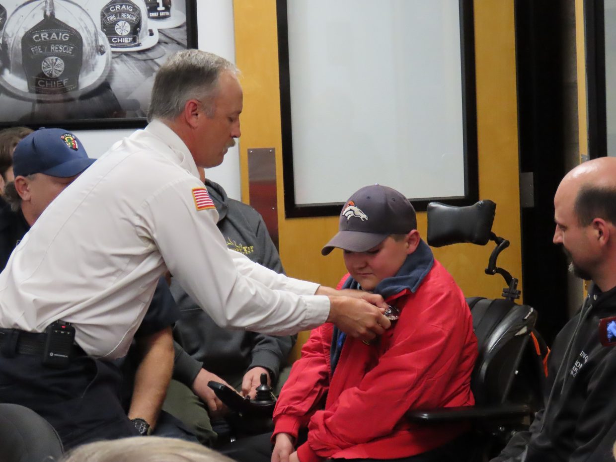 Craig teen with muscular dystrophy inducted as honorary firefighter ...