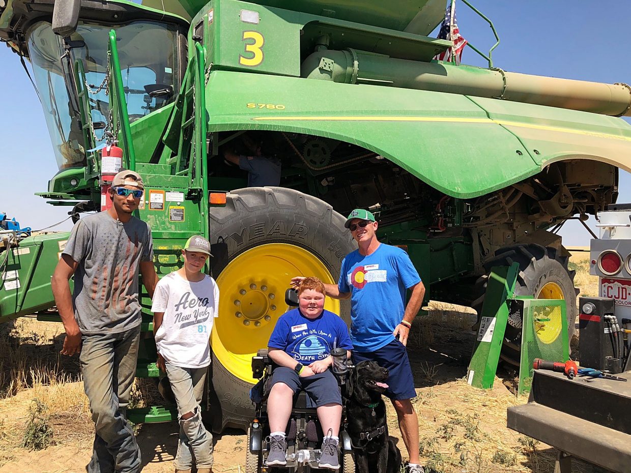 Teen with Duchenne Muscular Dystrophy gets to help with wheat harvest ...