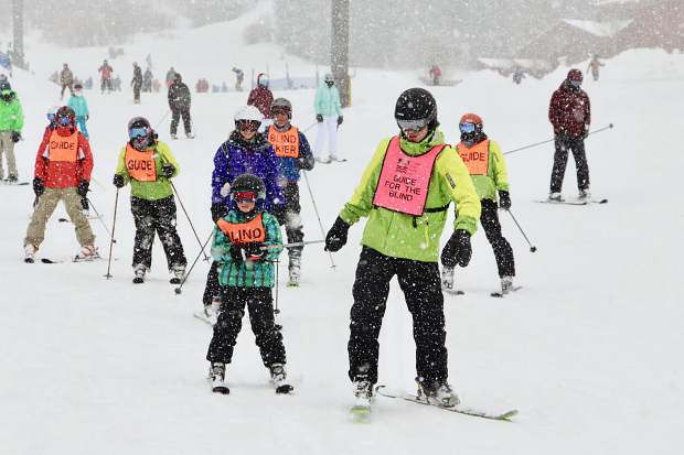 Photos: Blind skiers take to the fresh pow at Breckenridge Ski Resort ...