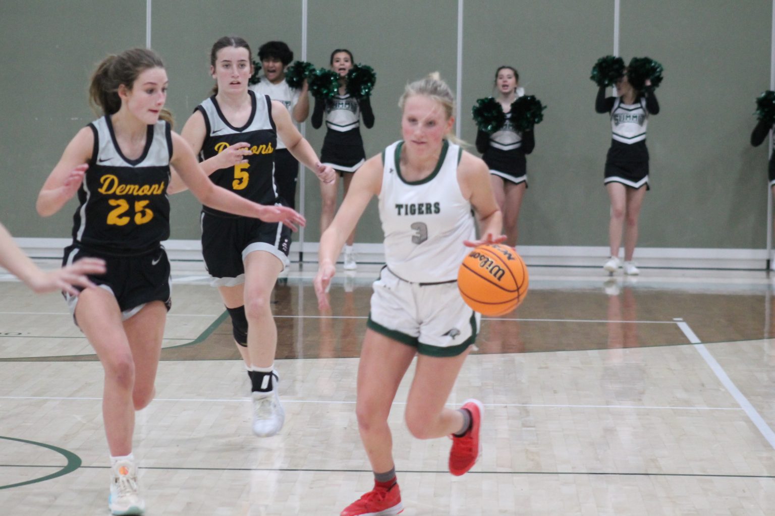 Summit High School girls basketball team falls to Golden in home opener ...