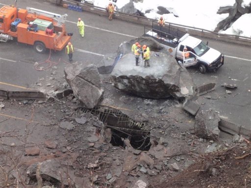 Crews hike to precarious boulder above I-70 | AspenTimes.com