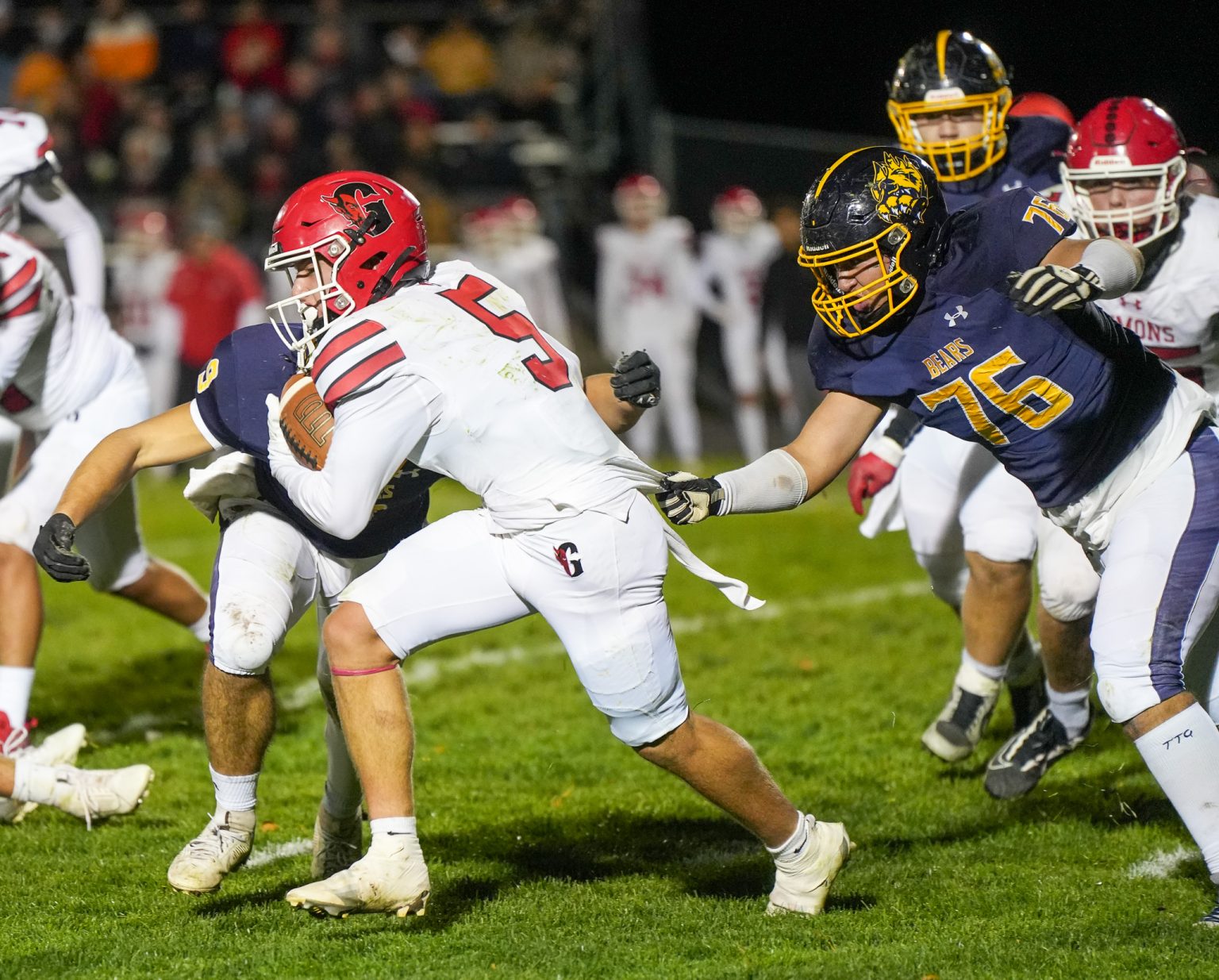 Demons dominate Bears 27-0 to keep playoff hopes alive ...