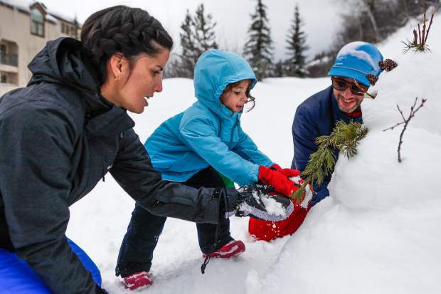 Photos: More snow falls Tuesday, delighting skiers and frustrating ...