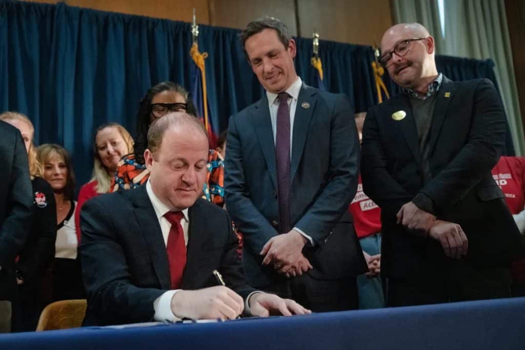 Colorado governor signs four gun bills into law in a historic change to ...
