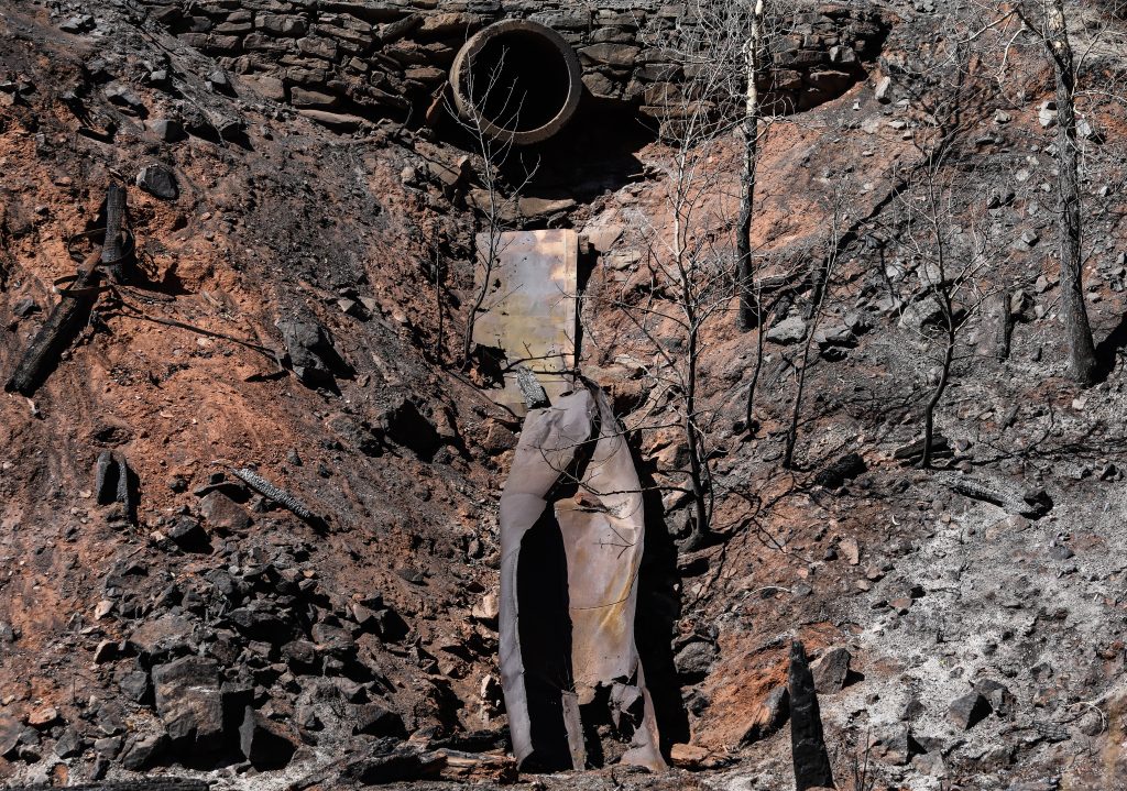 PHOTOS: Fire crews tamp down hot spots from wildfire between I-70 and ...