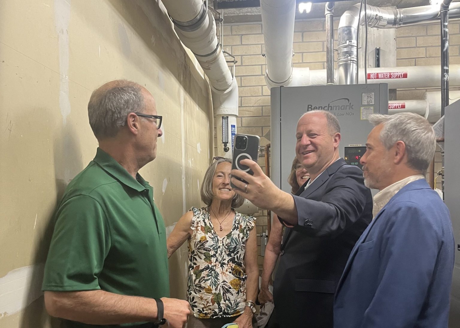 Polis honors gubernatorial tradition while celebrating a clean energy ...