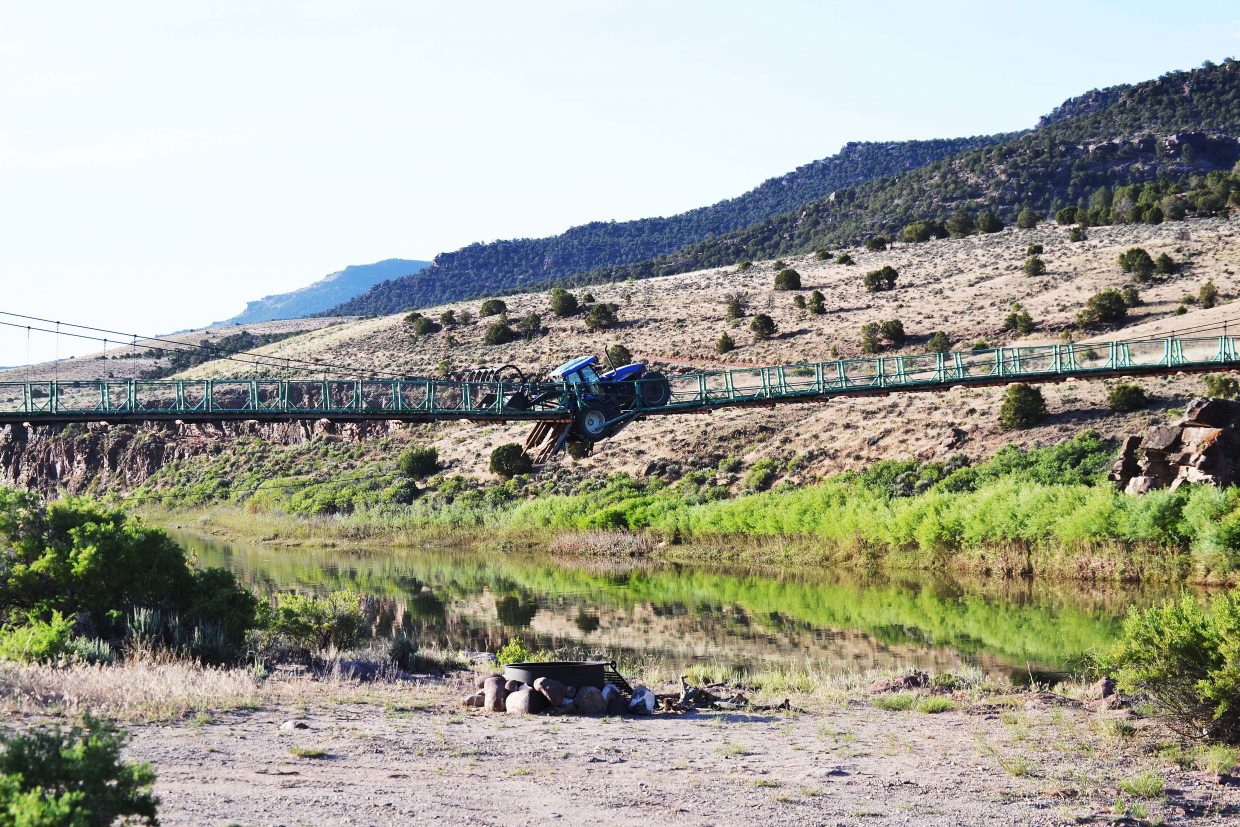 Tractor stuck on Swinging Bridge in Browns Park | SteamboatToday.com