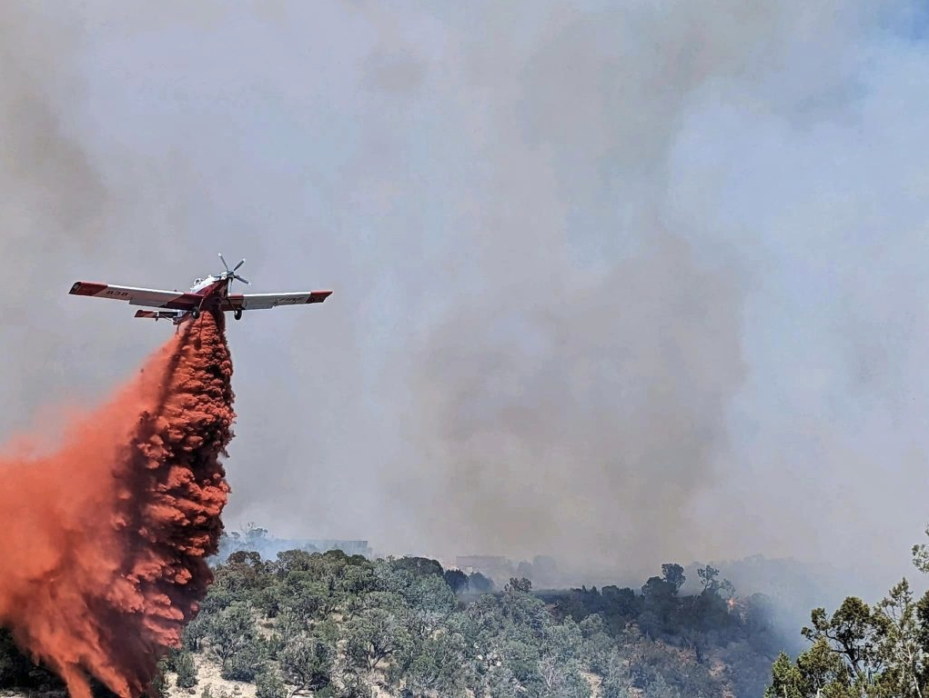 Air, ground crews continue to quell brush fire west of Parachute ...