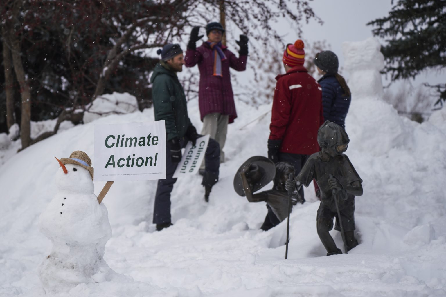 Photos: Students, community members create snowmen against climate ...