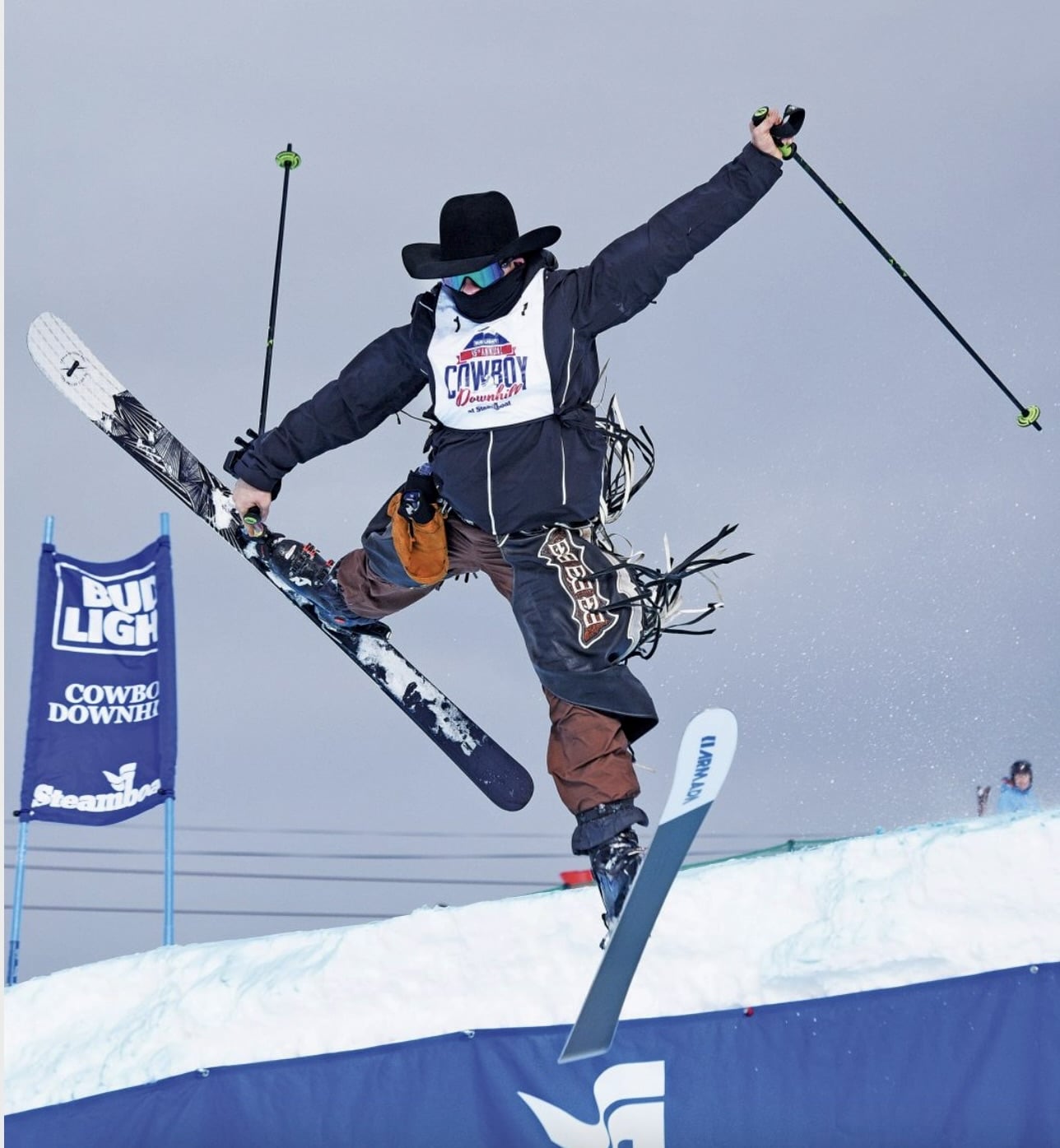 Rodeo riders hold on to their hats — and ski poles — at the Cowboy ...