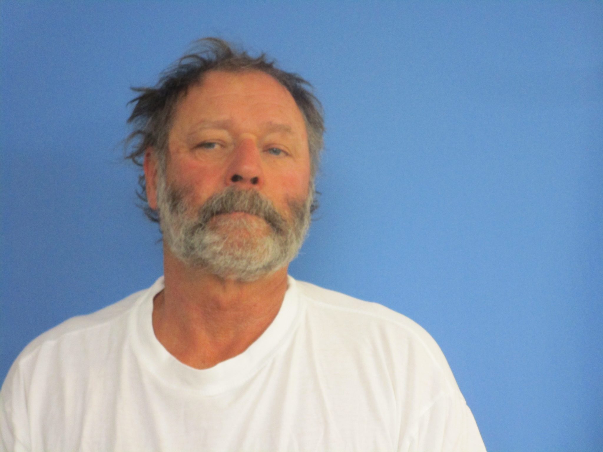 Resident says a neighbor broke into his home with a gun over an ...