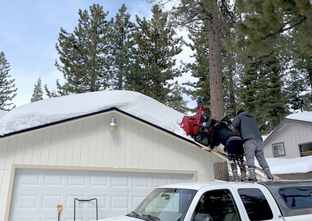 Storm prep: Businesses, residents scramble to remove snow, bag sand ...